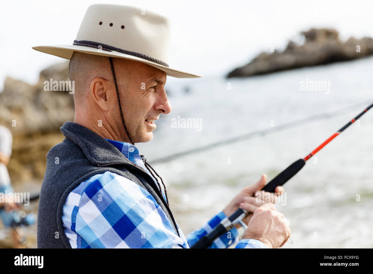 Picture of fisherman fishing with rods Stock Photo - Alamy