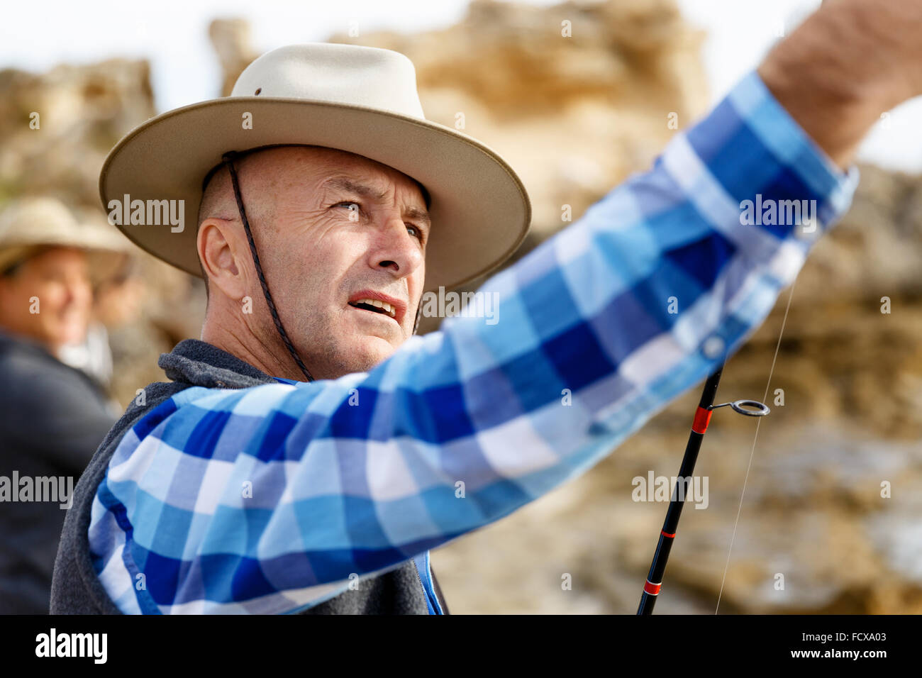 Picture of fisherman fishing with rods Stock Photo - Alamy