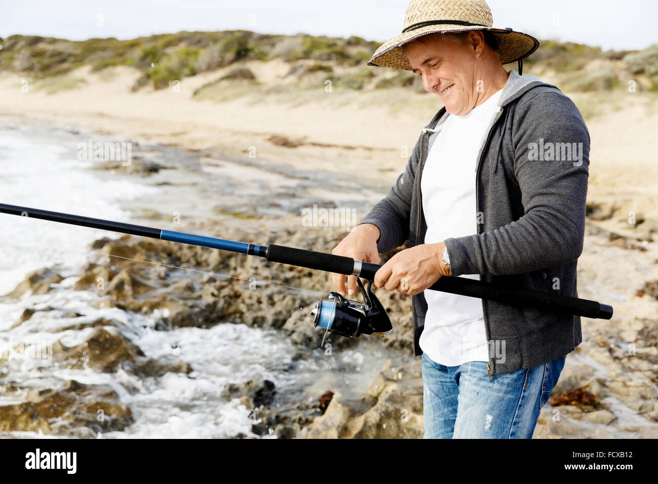 Picture of fisherman fishing with rods Stock Photo - Alamy