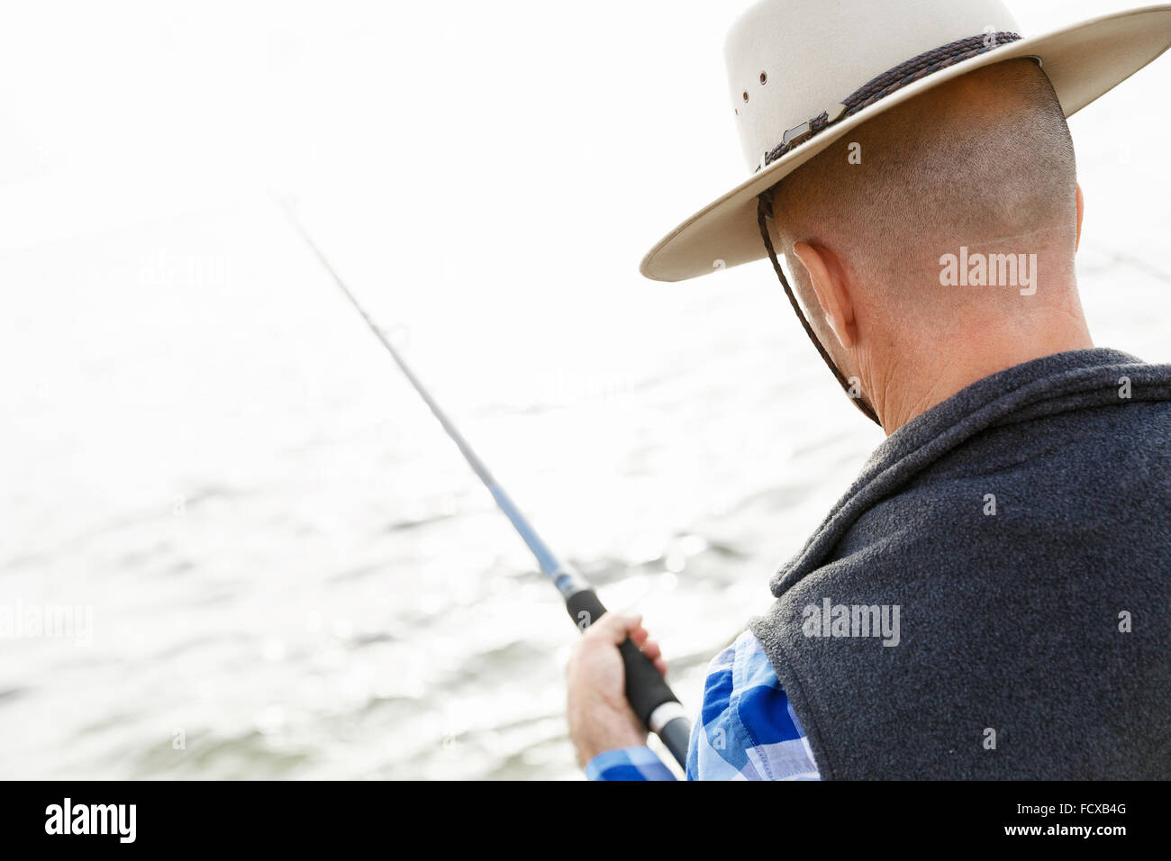 Picture of fisherman fishing with rods Stock Photo - Alamy
