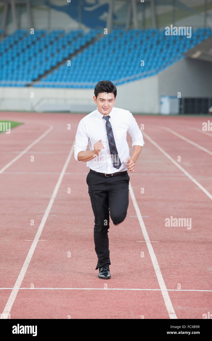 Man in suit running hi-res stock photography and images - Alamy
