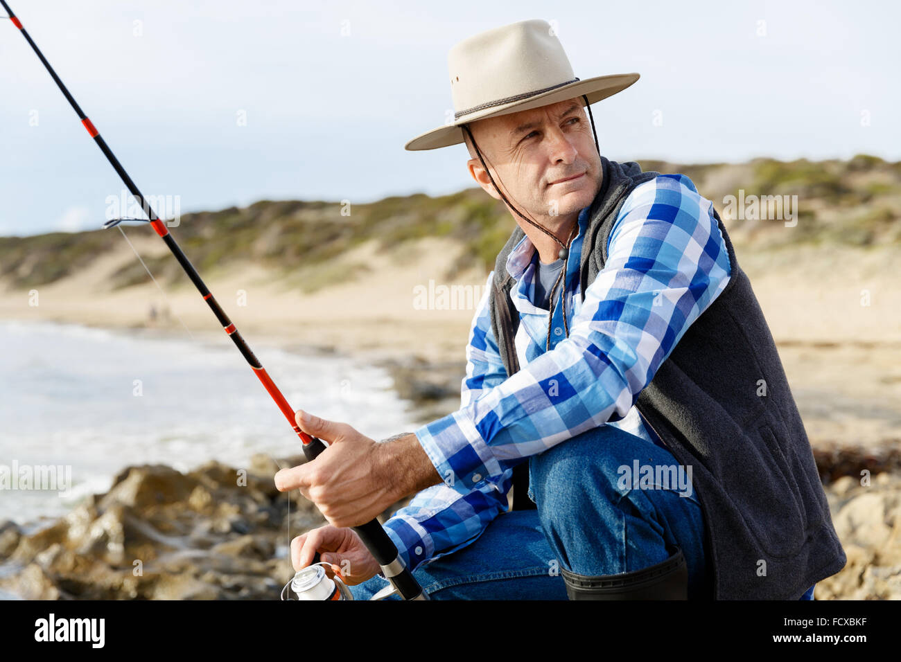 Picture of fisherman fishing with rods Stock Photo - Alamy