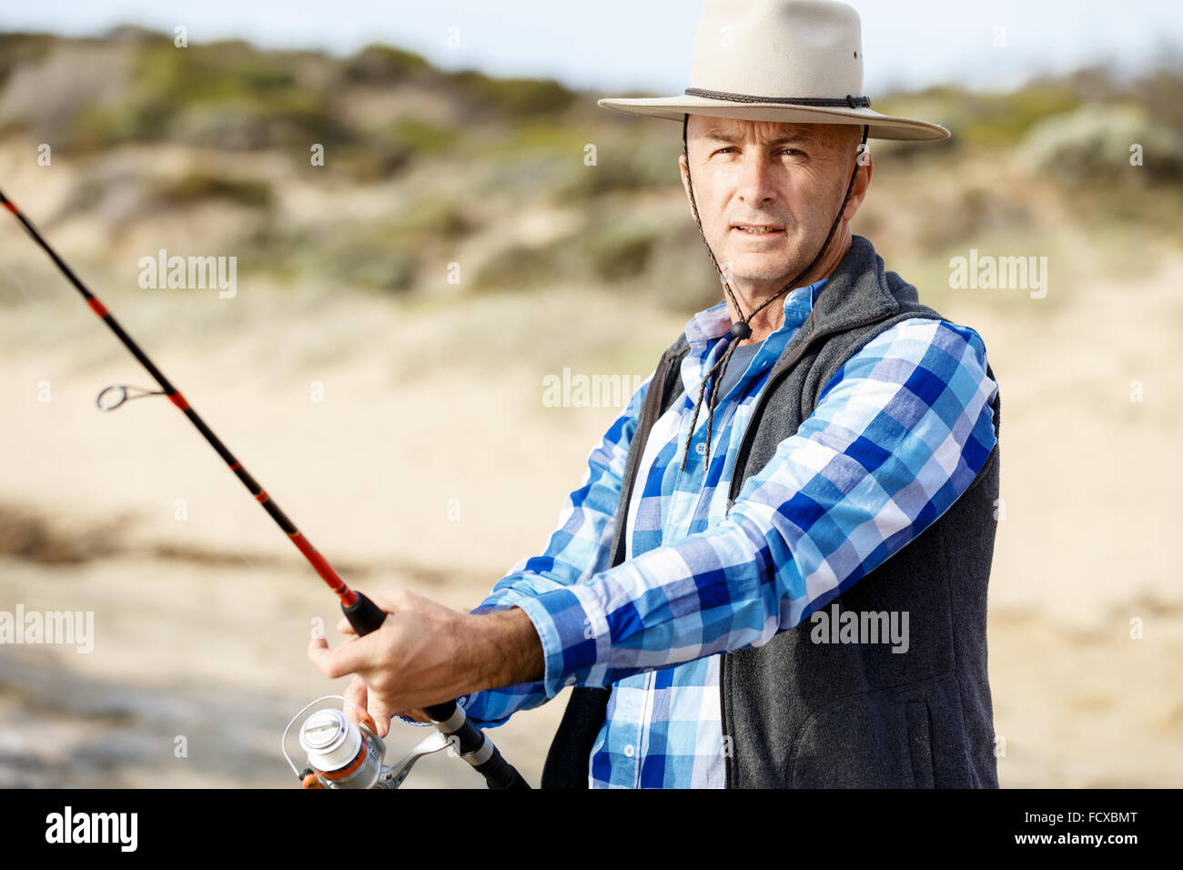 Picture of fisherman fishing with rods Stock Photo - Alamy