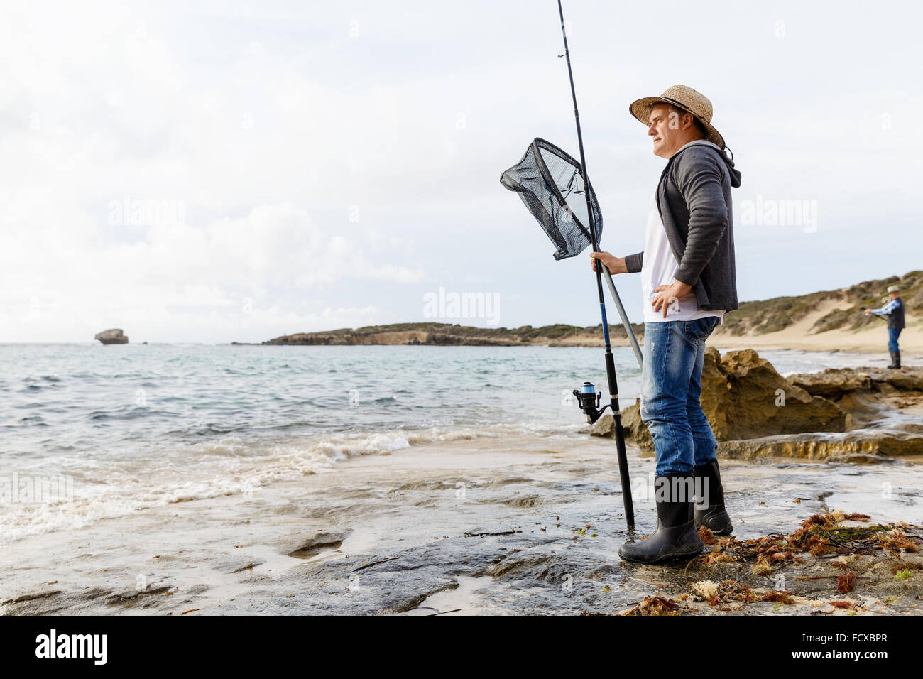 Picture of fisherman fishing with rods Stock Photo - Alamy