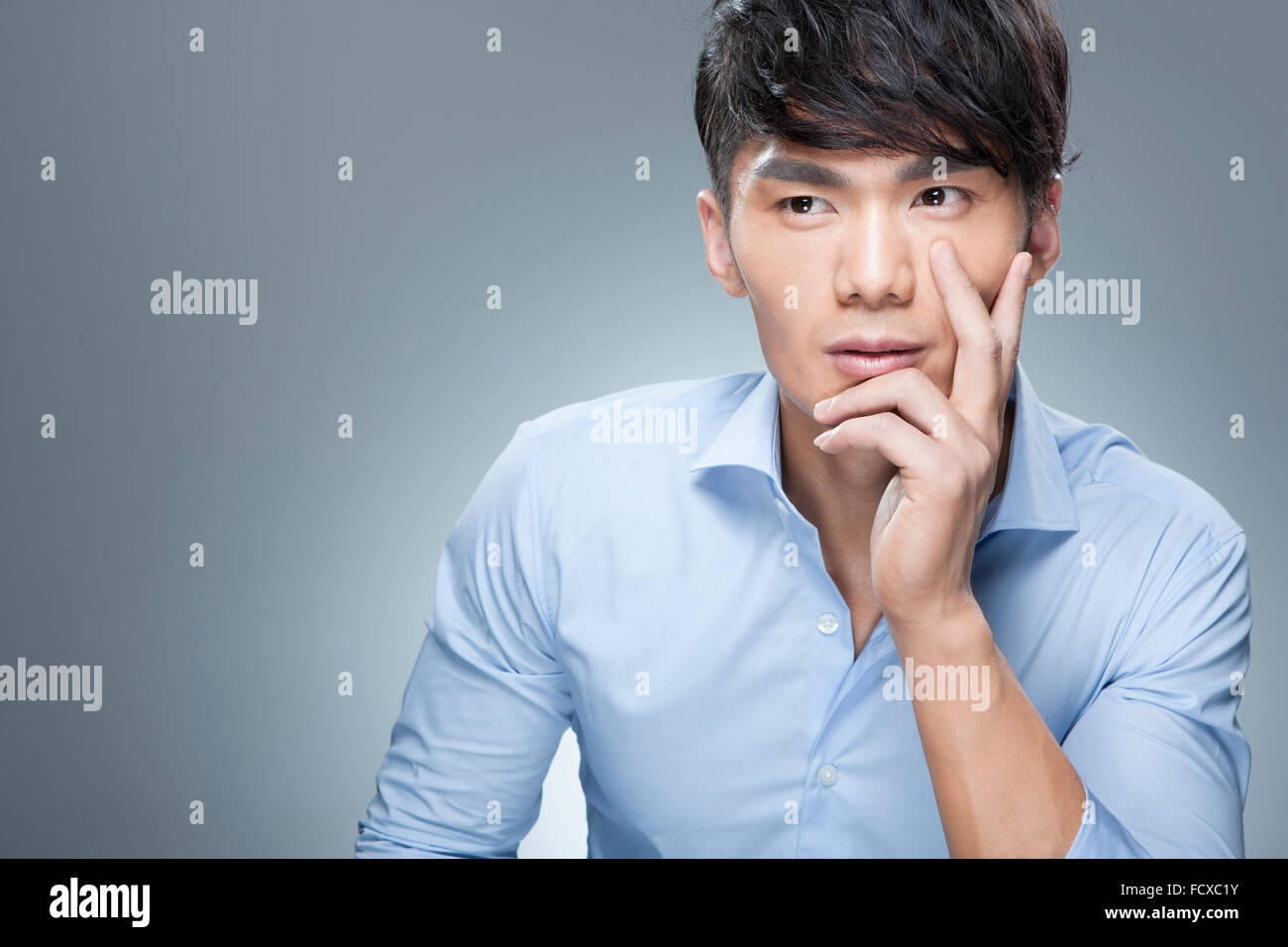 Putting hand on her chin hi-res stock photography and images - Alamy