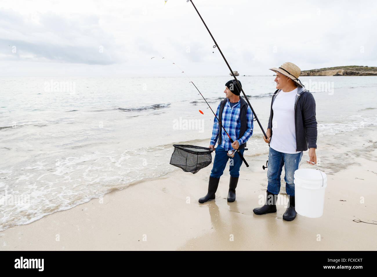 Picture of fishermen fishing with rods Stock Photo - Alamy
