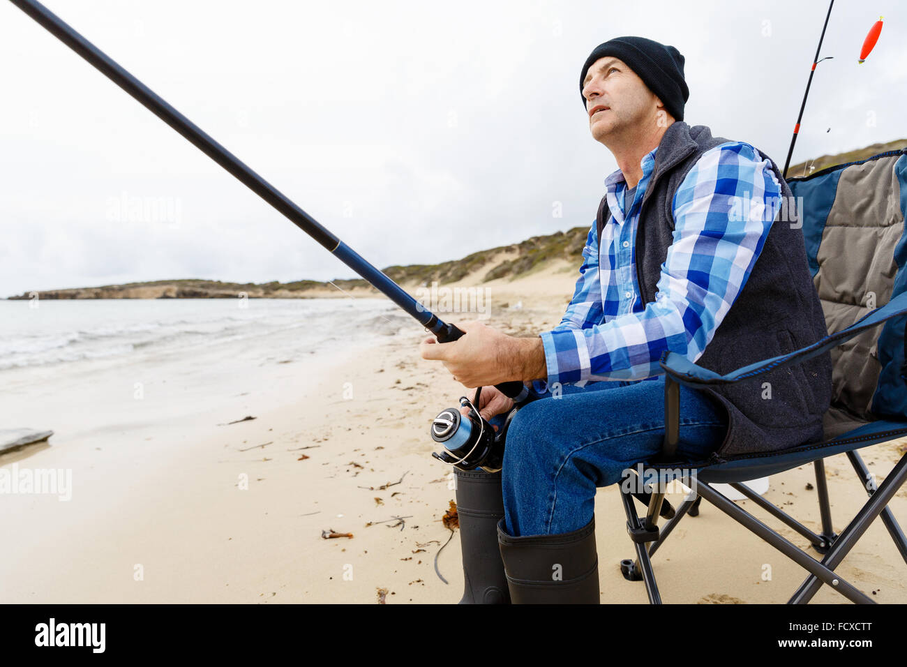 Picture of fisherman fishing with rods Stock Photo - Alamy