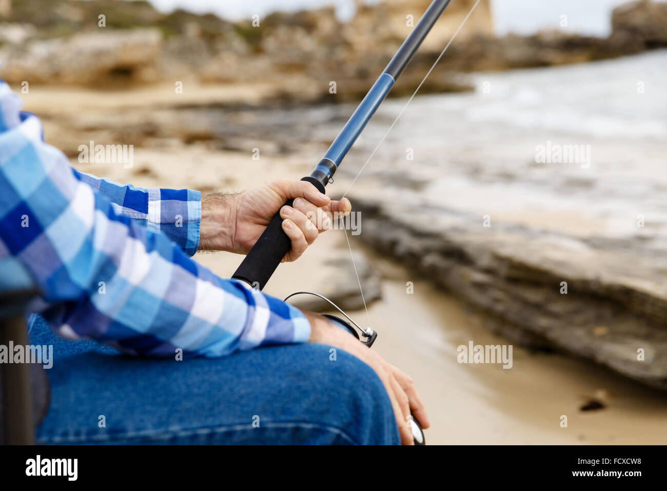 Picture of fisherman fishing with rods Stock Photo - Alamy