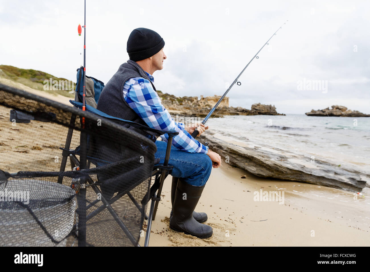 Picture of fisherman fishing with rods Stock Photo - Alamy