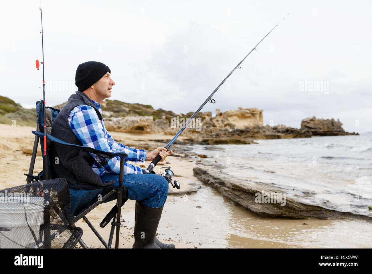 Picture of fisherman fishing with rods Stock Photo - Alamy