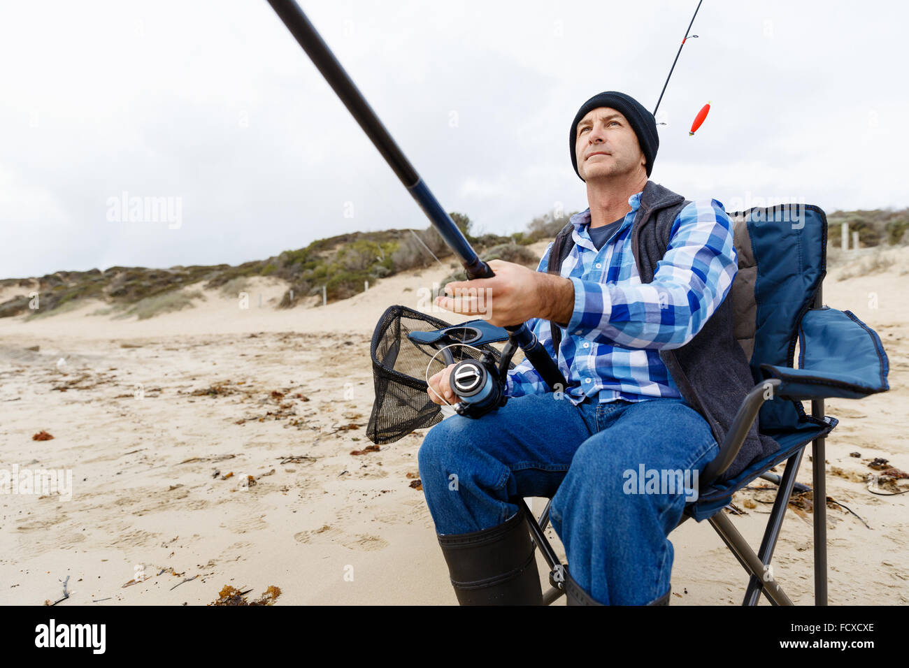Picture of fisherman fishing with rods Stock Photo - Alamy