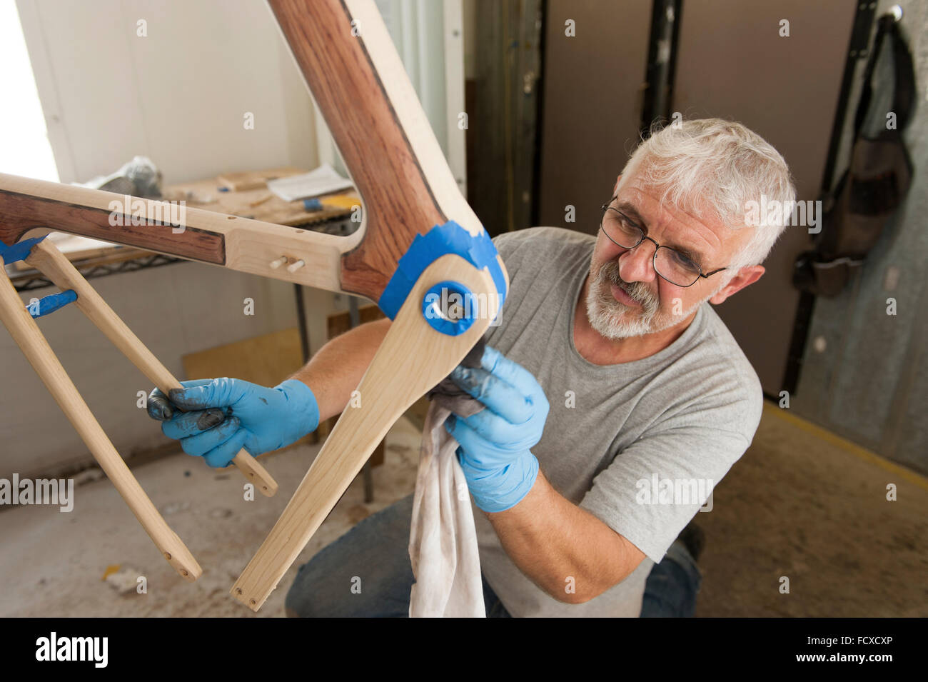 Skilled craftsmen create beautiful wooden frames from raw wood to ...