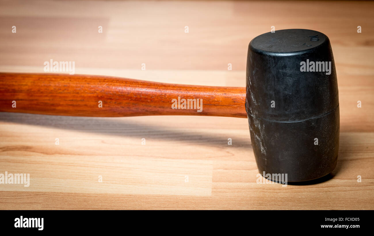 Side of a wood handled rubber mallet Stock Photo - Alamy