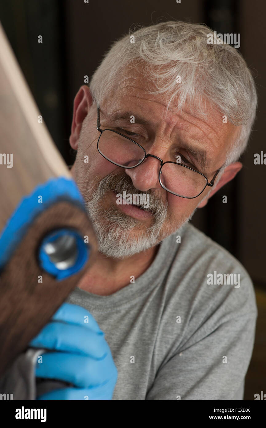 Skilled craftsmen create beautiful wooden frames from raw wood to ...