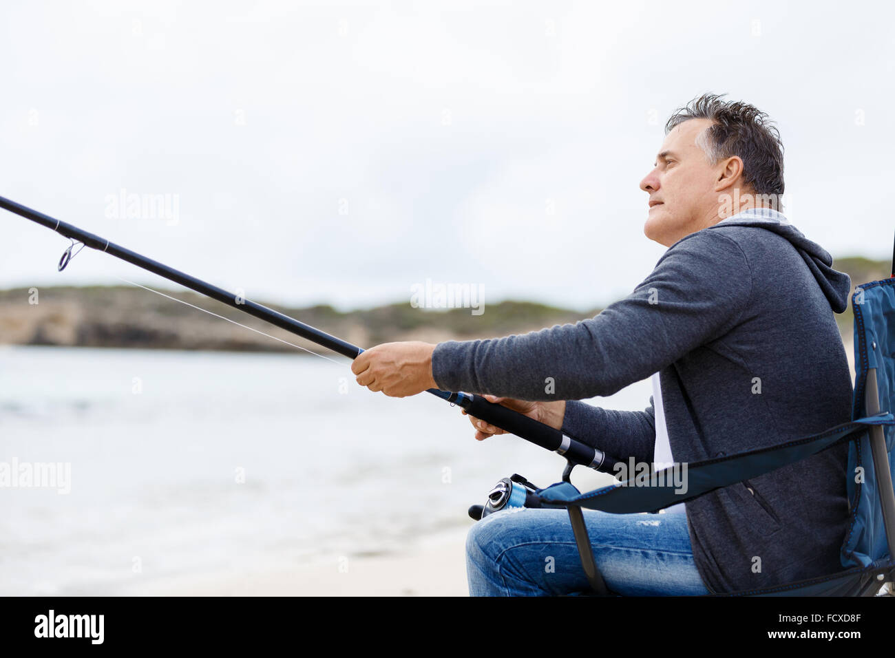 Picture of fisherman fishing with rods Stock Photo - Alamy