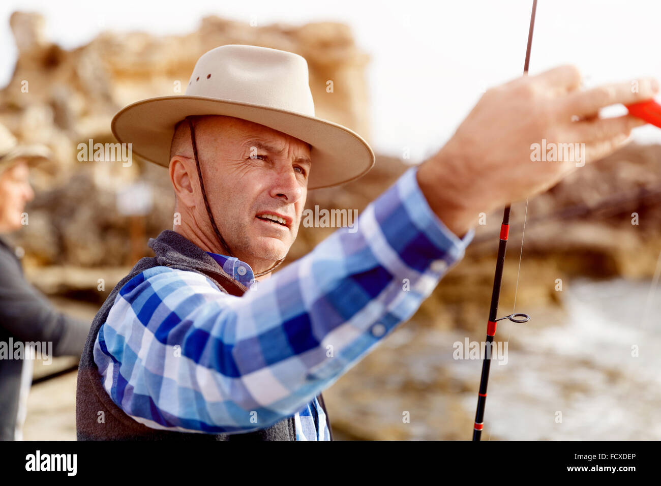 Picture of fisherman fishing with rods Stock Photo - Alamy