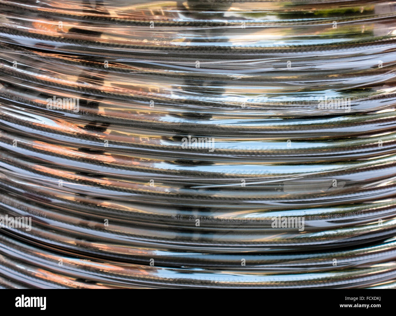 a coil of silver electric cable, background Stock Photo - Alamy