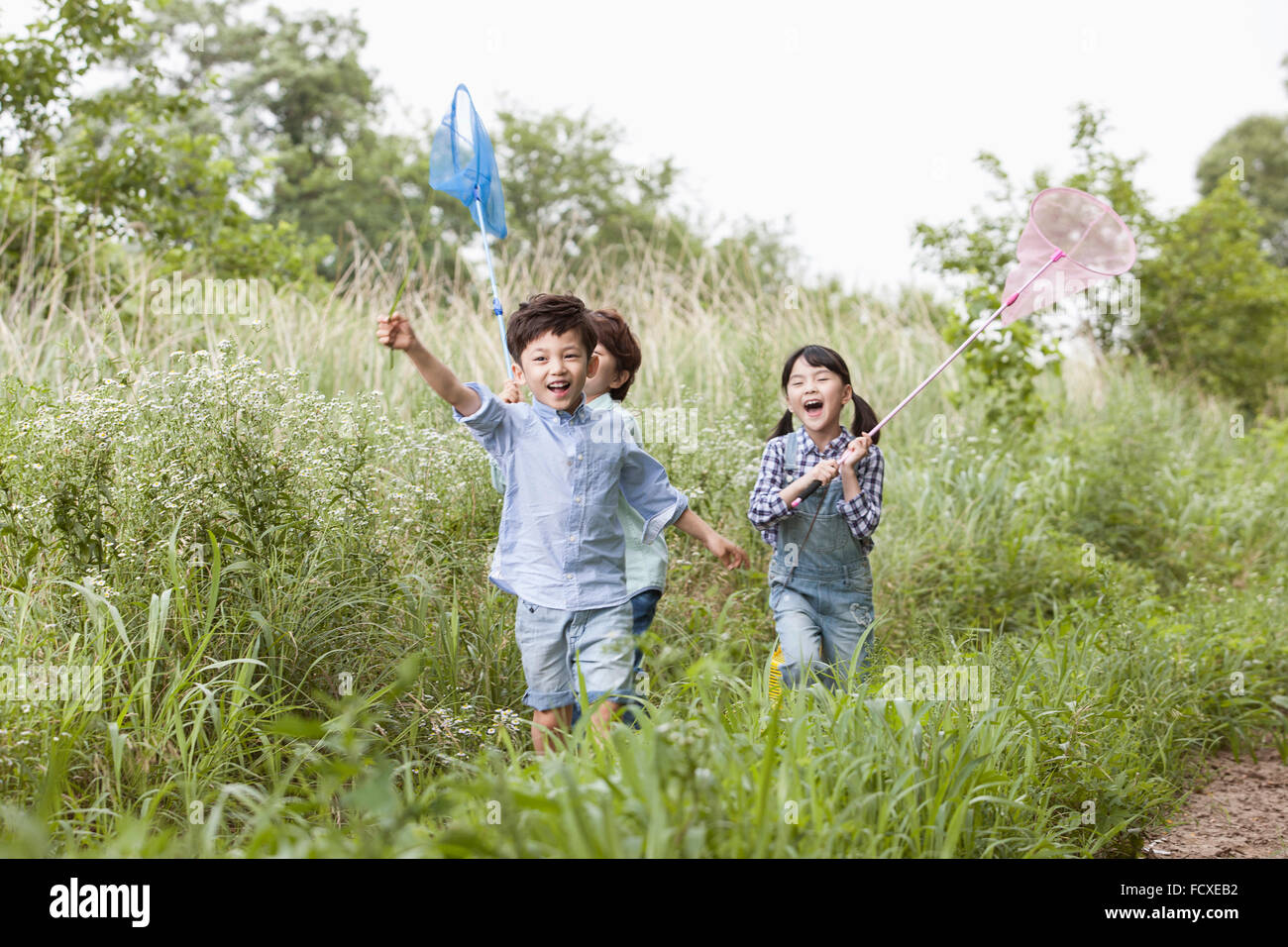 Three kids having fun hi-res stock photography and images - Alamy