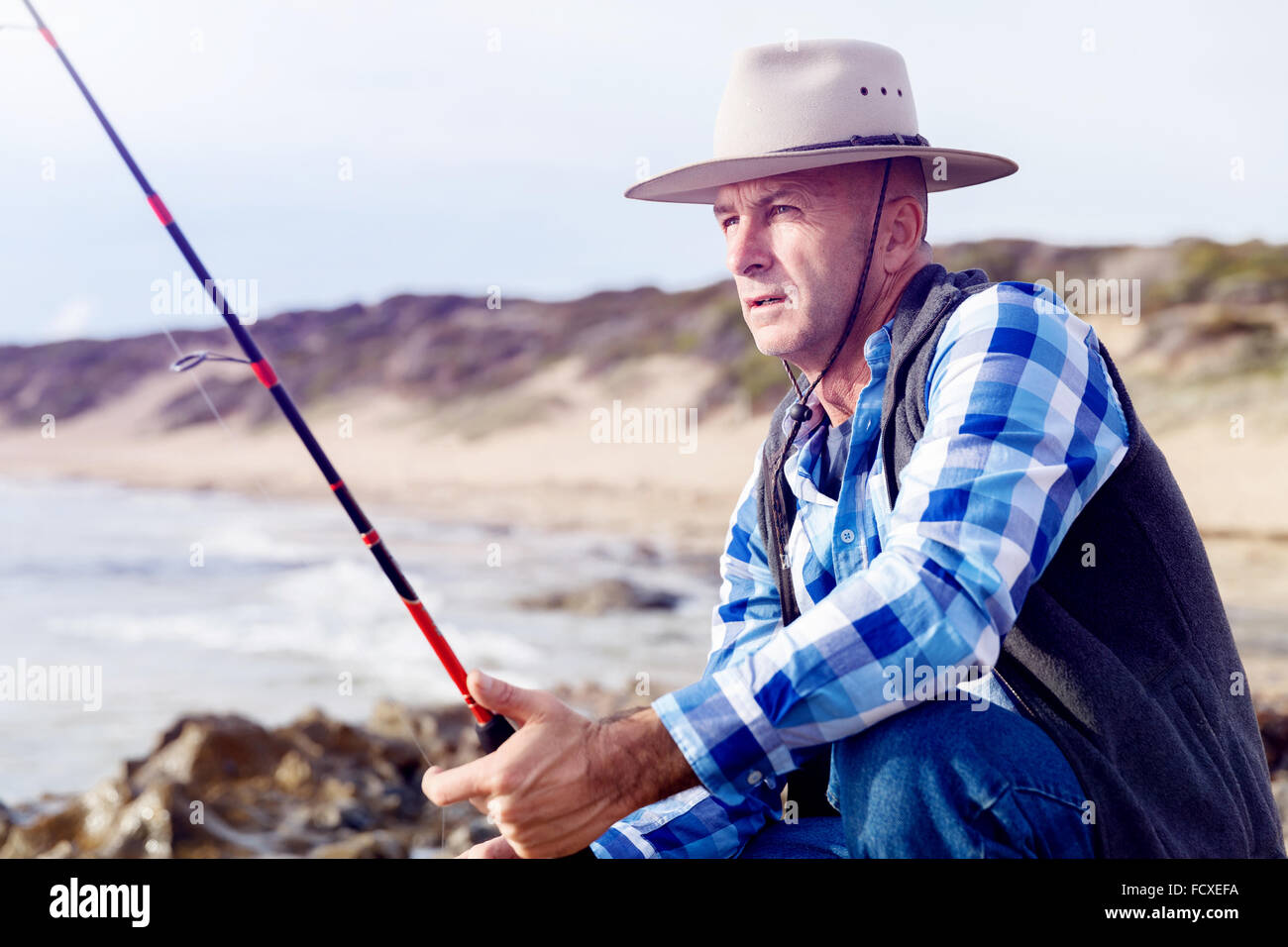 Picture of fisherman fishing with rods Stock Photo - Alamy