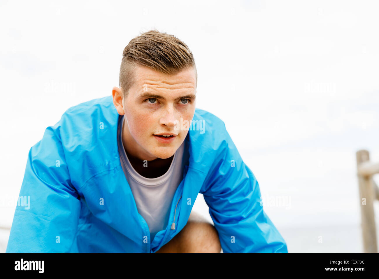 Male runner getting ready to start his race Stock Photo - Alamy