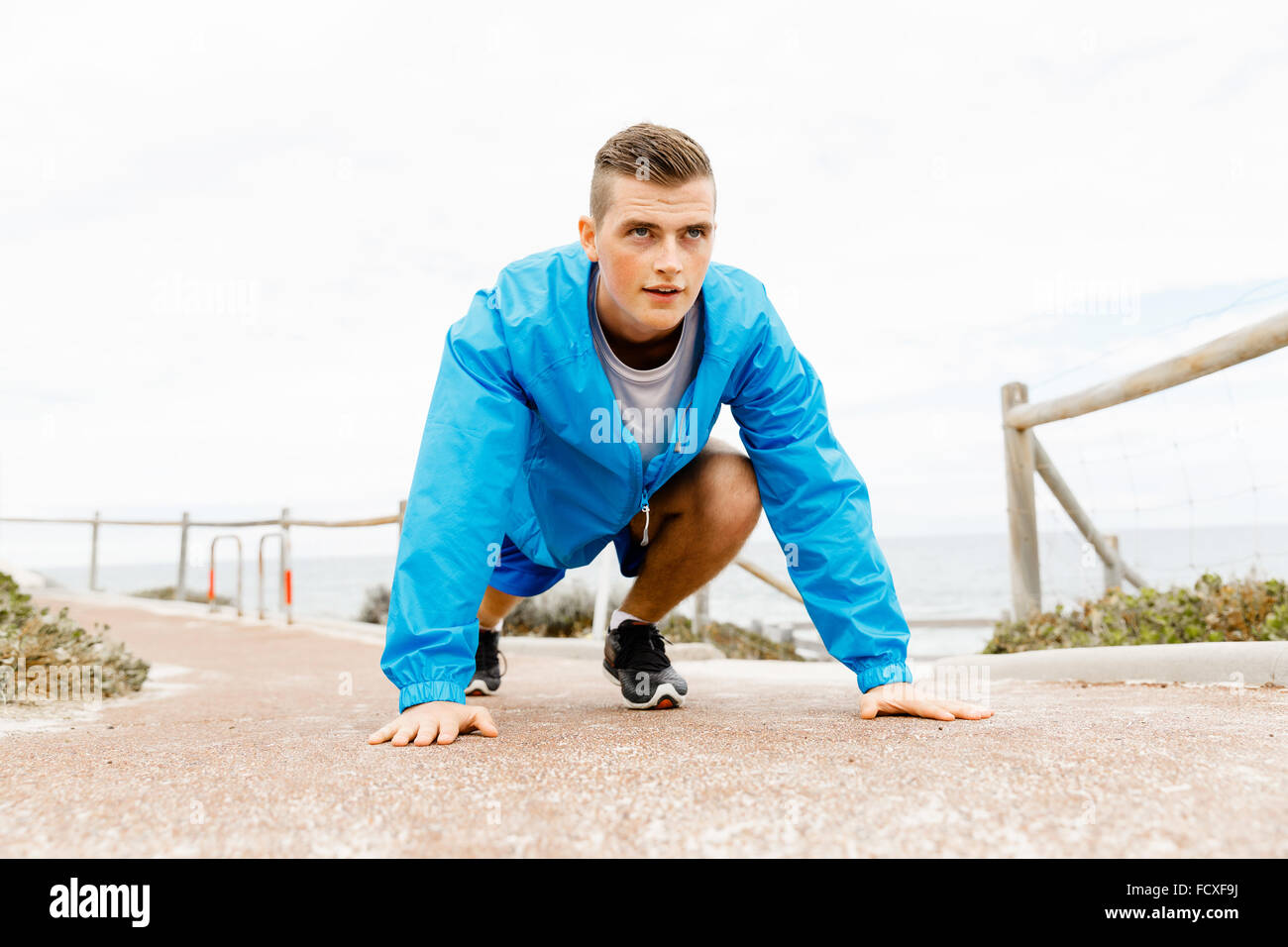 Male runner getting ready to start his race Stock Photo - Alamy Male runner getting ready to start his race Stock Photo - Alamy