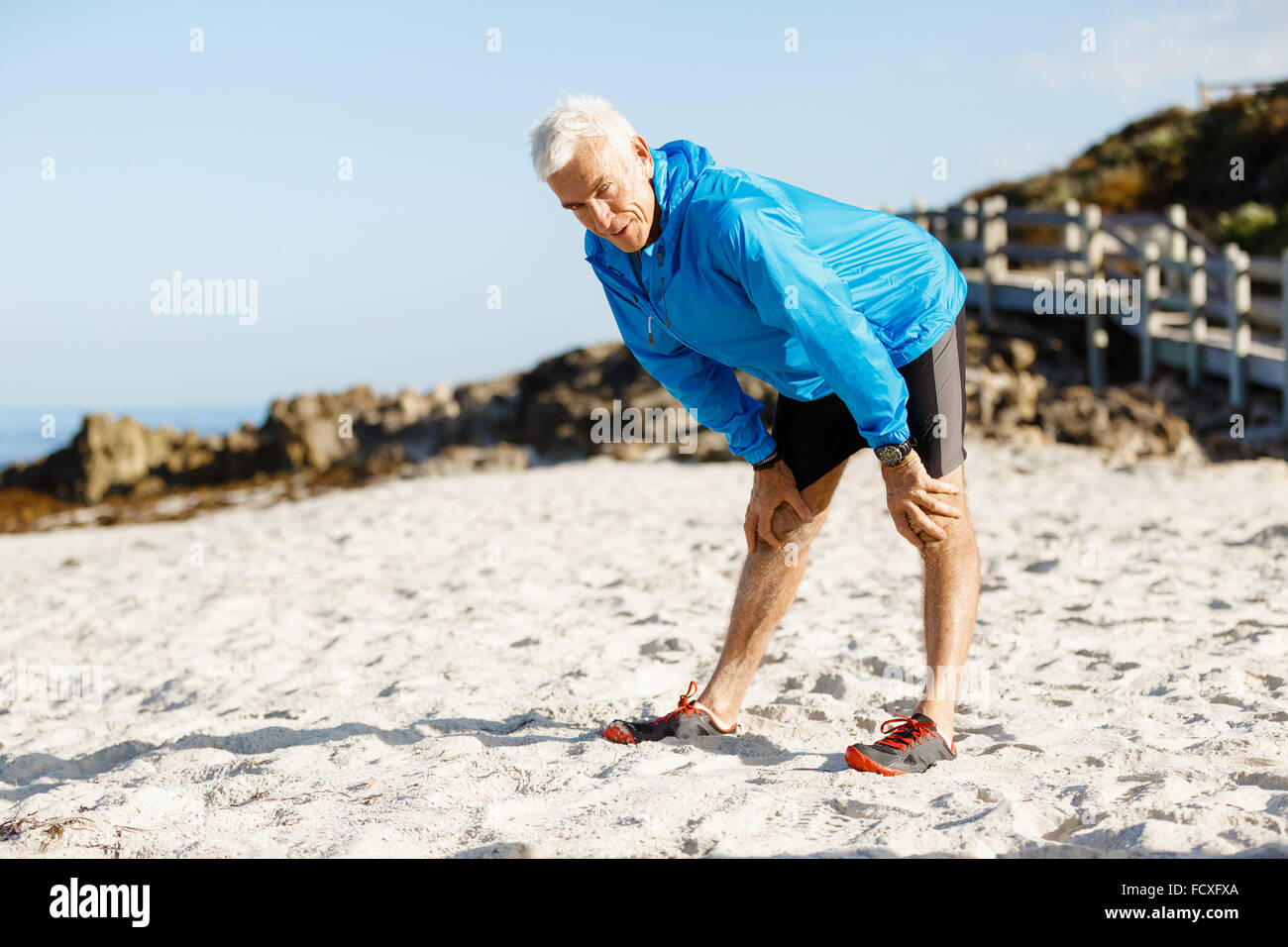 Handsome athlete man tired after long run Stock Photo - Alamy