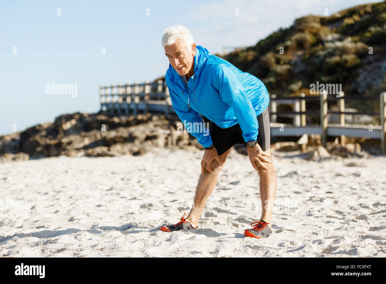 Handsome athlete man tired after long run Stock Photo - Alamy