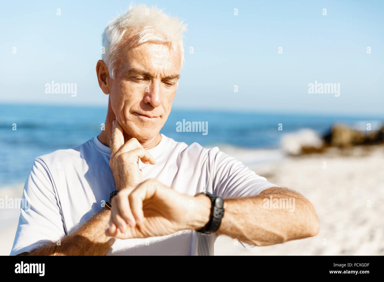 Runner checking his heart rate pulse during workout Stock Photo - Alamy