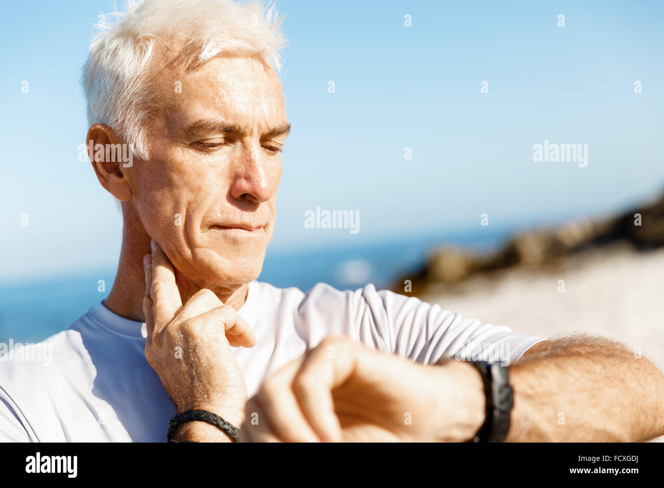 Runner checking his heart rate pulse during workout Stock Photo - Alamy