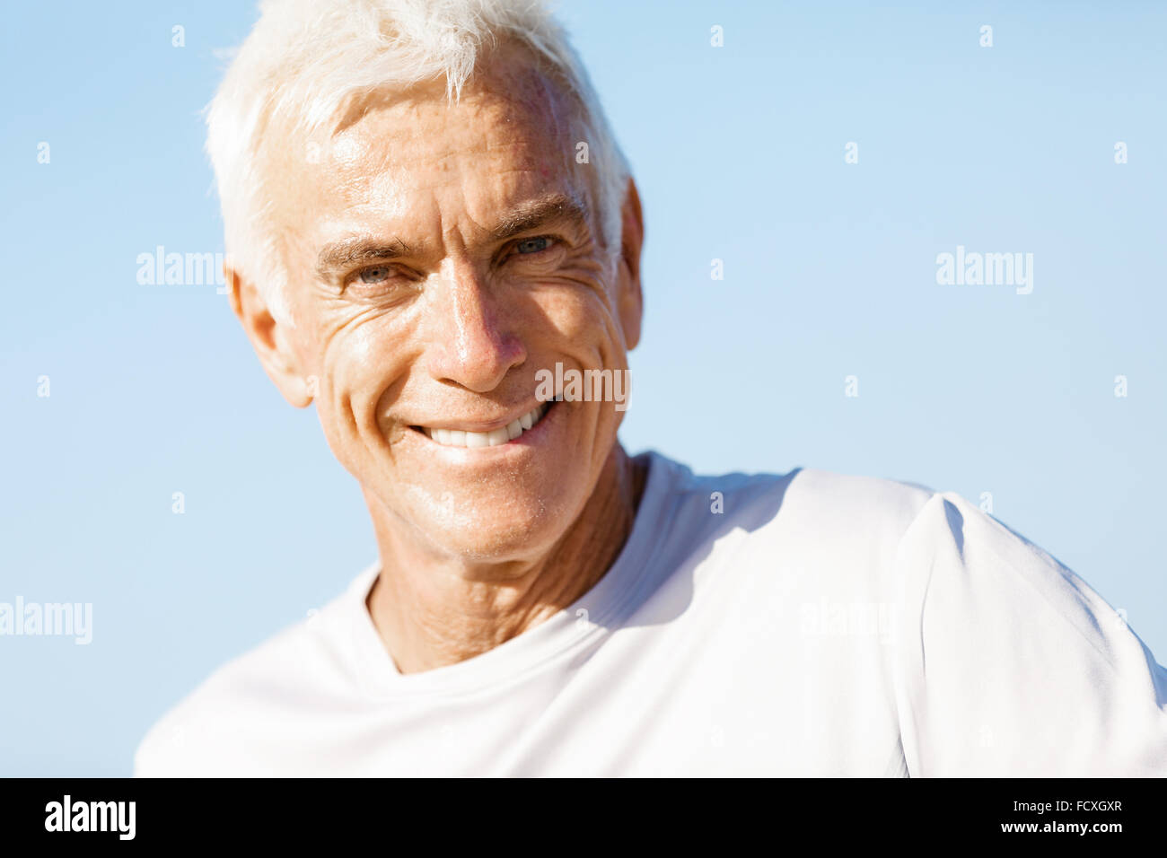 Portrait of healthy senior man smiling at camera Stock Photo - Alamy
