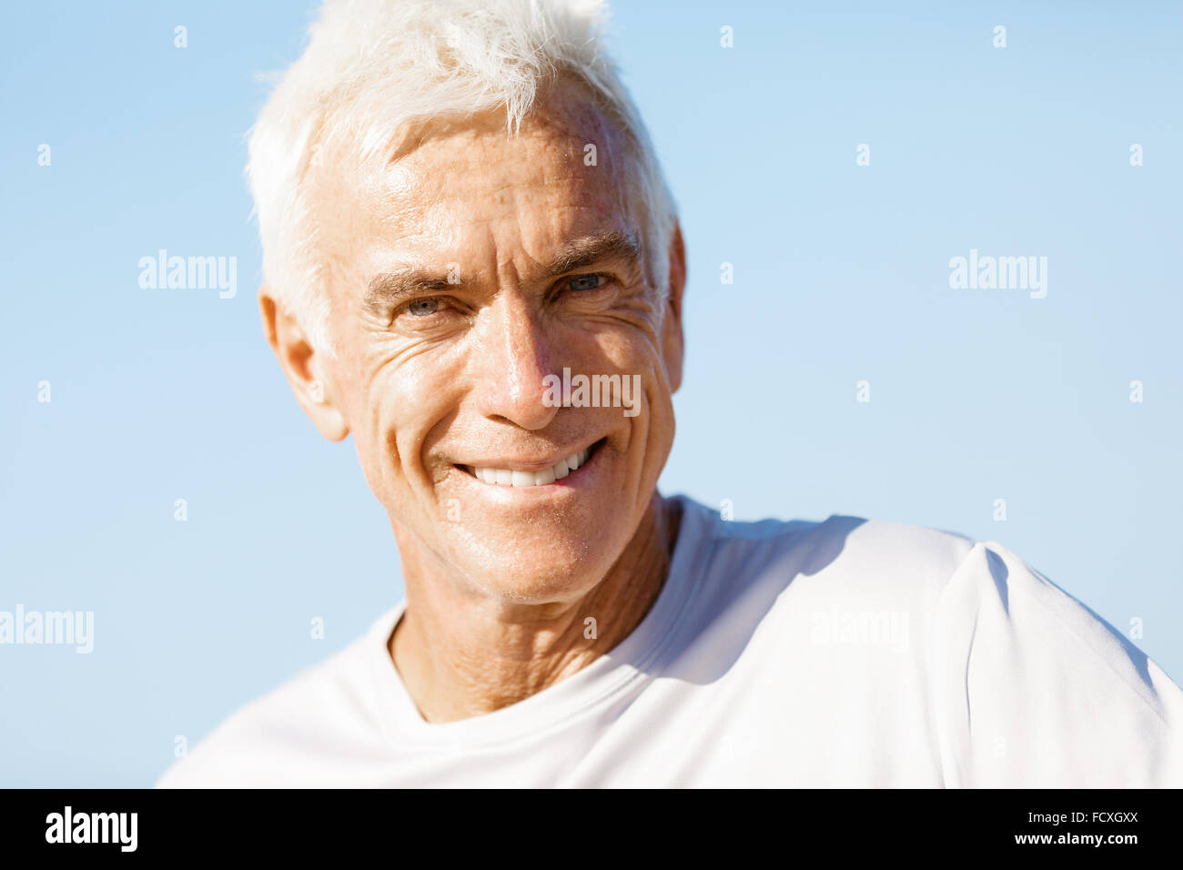 Portrait of healthy senior man smiling at camera Stock Photo - Alamy