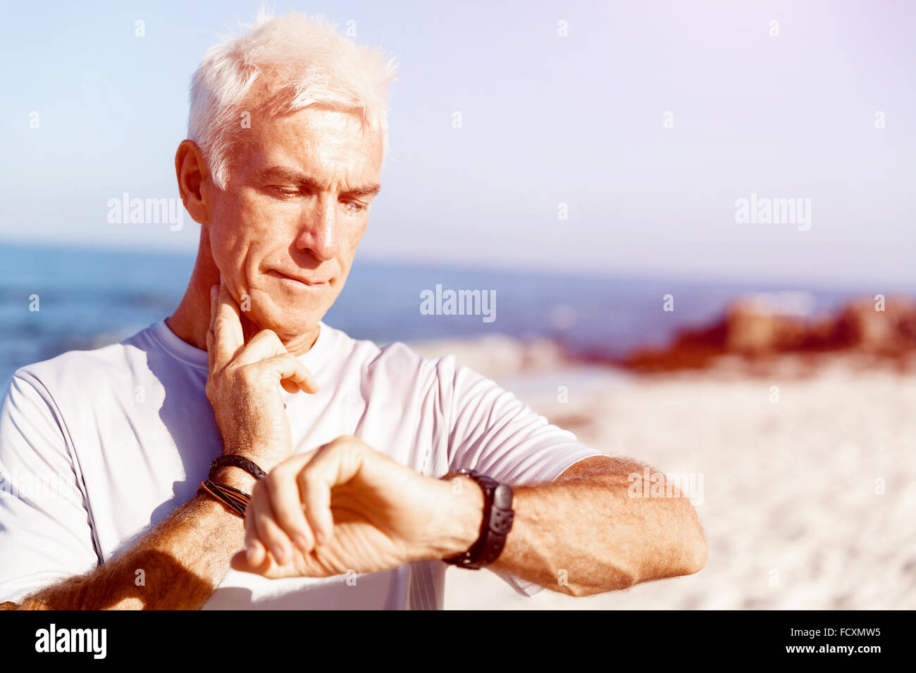 Runner checking his heart rate pulse during workout Stock Photo - Alamy
