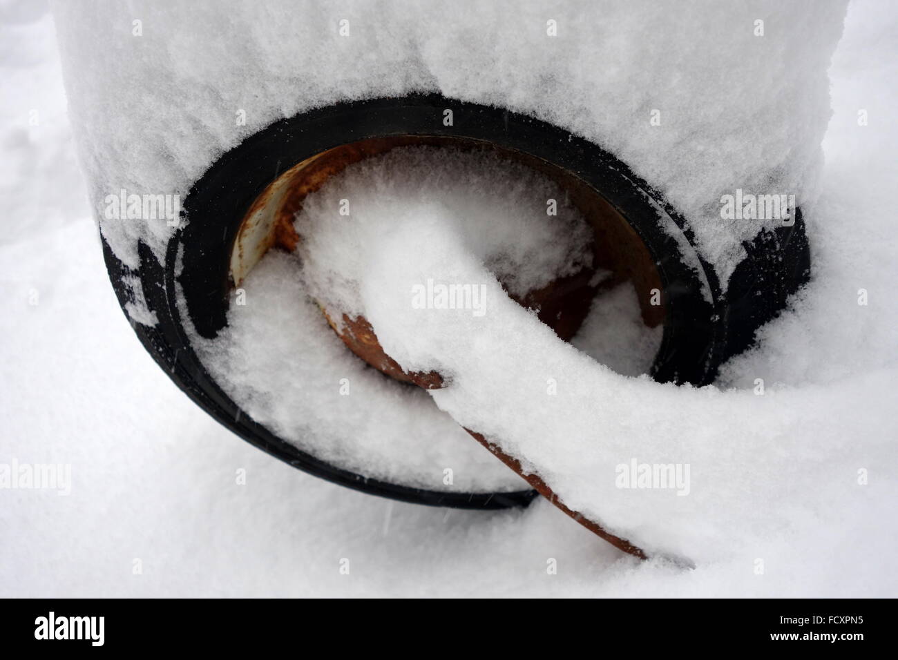 Snow covered wheelbarrow Stock Photo - Alamy
