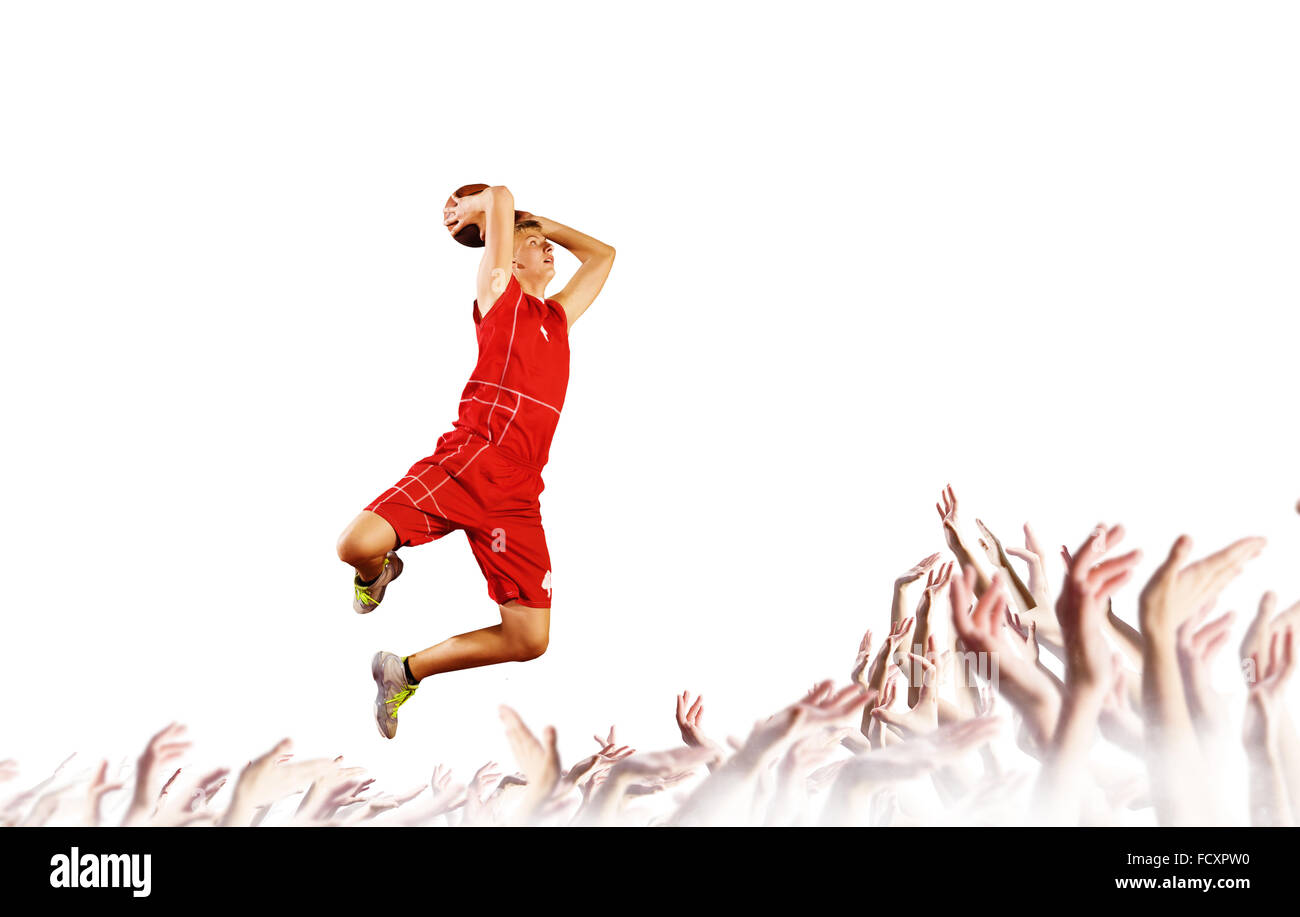 Young man basketball player with ball in hands jumping high Stock Photo ...