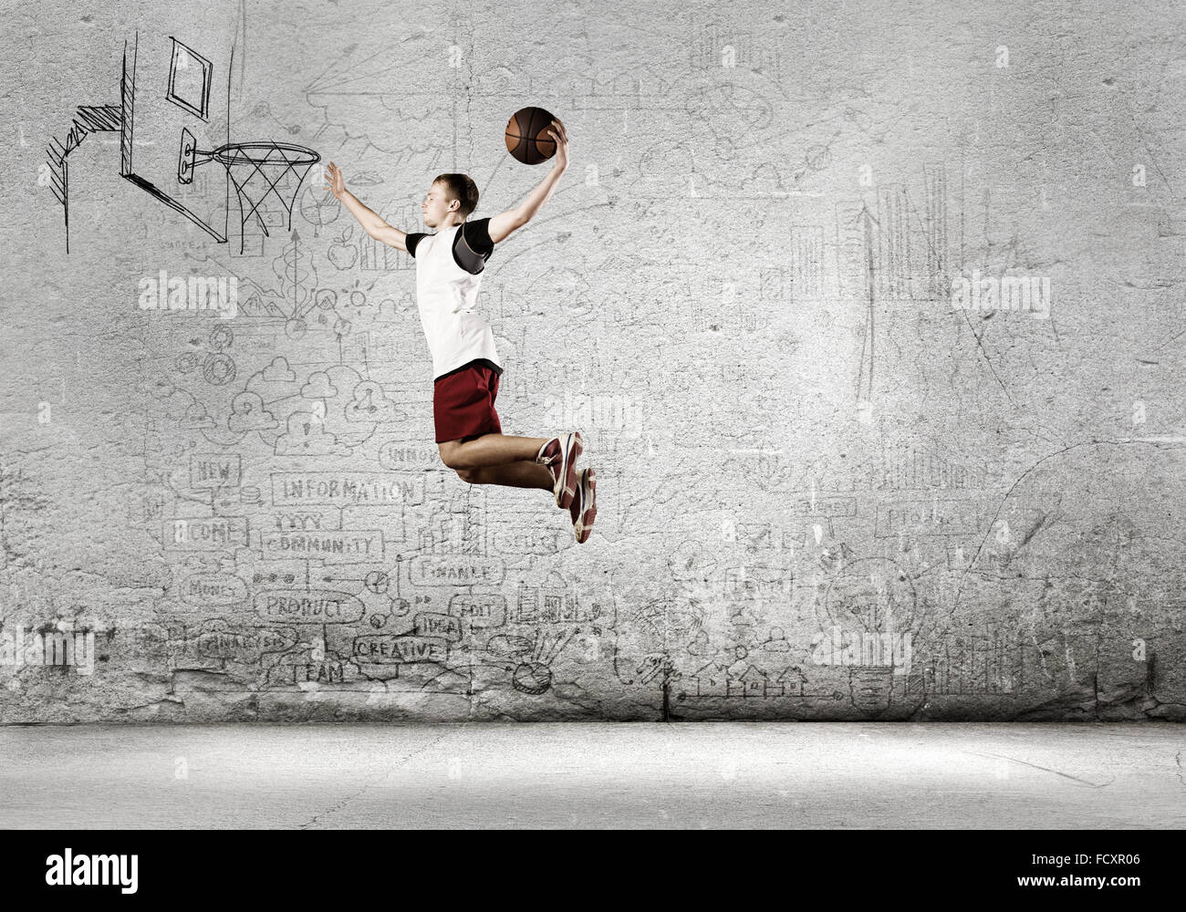 Young man basketball player throwing ball in basket Stock Photo - Alamy