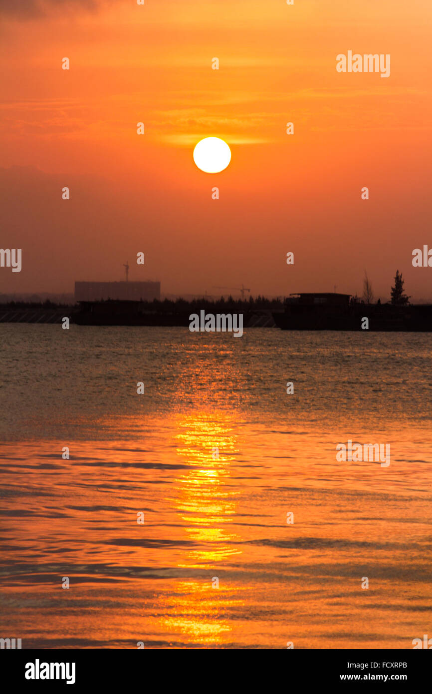 Hainan, China - The beautiful sunset view at sea beach Stock Photo - Alamy