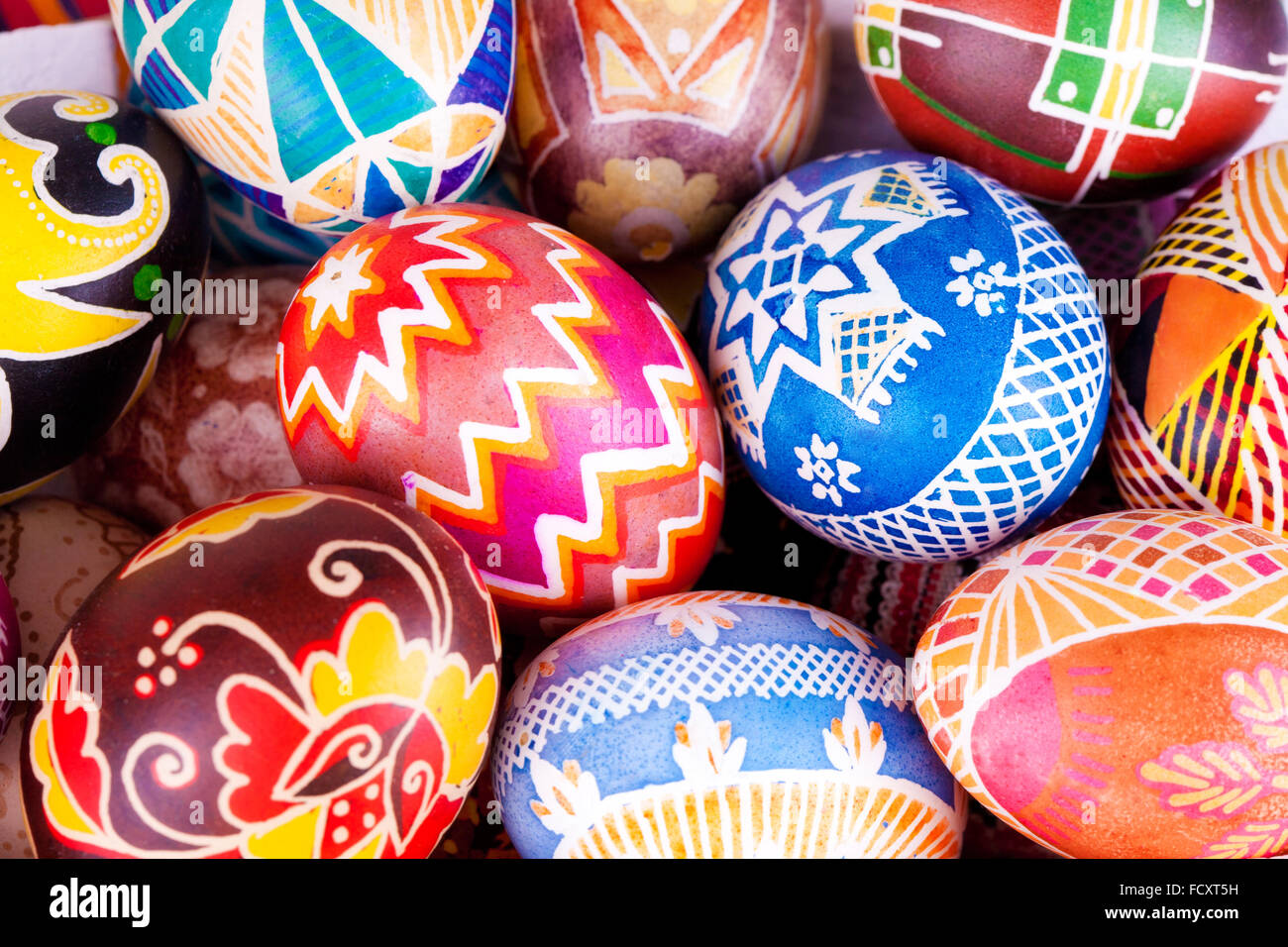 Mix of colored eggs with the traditional designs Stock Photo - Alamy