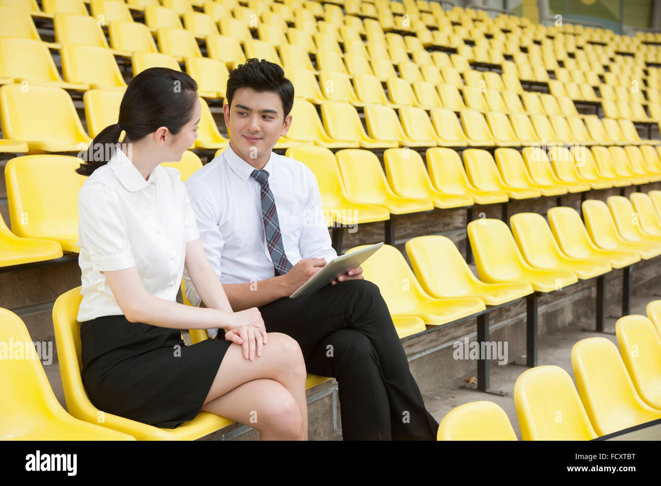 Two people sitting stadium hi-res stock photography and images - Alamy