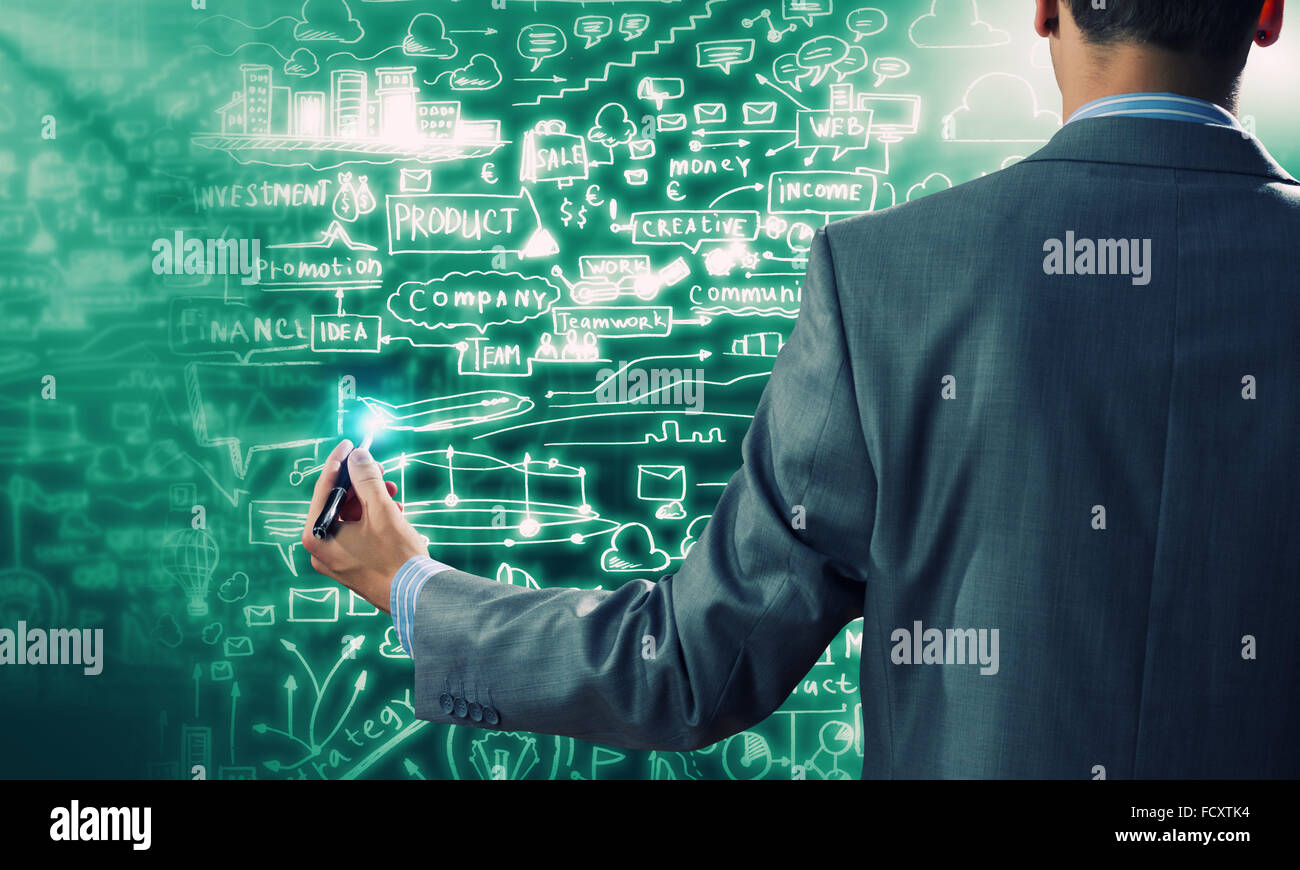 Back view of confident businessman drawing business sketches Stock ...