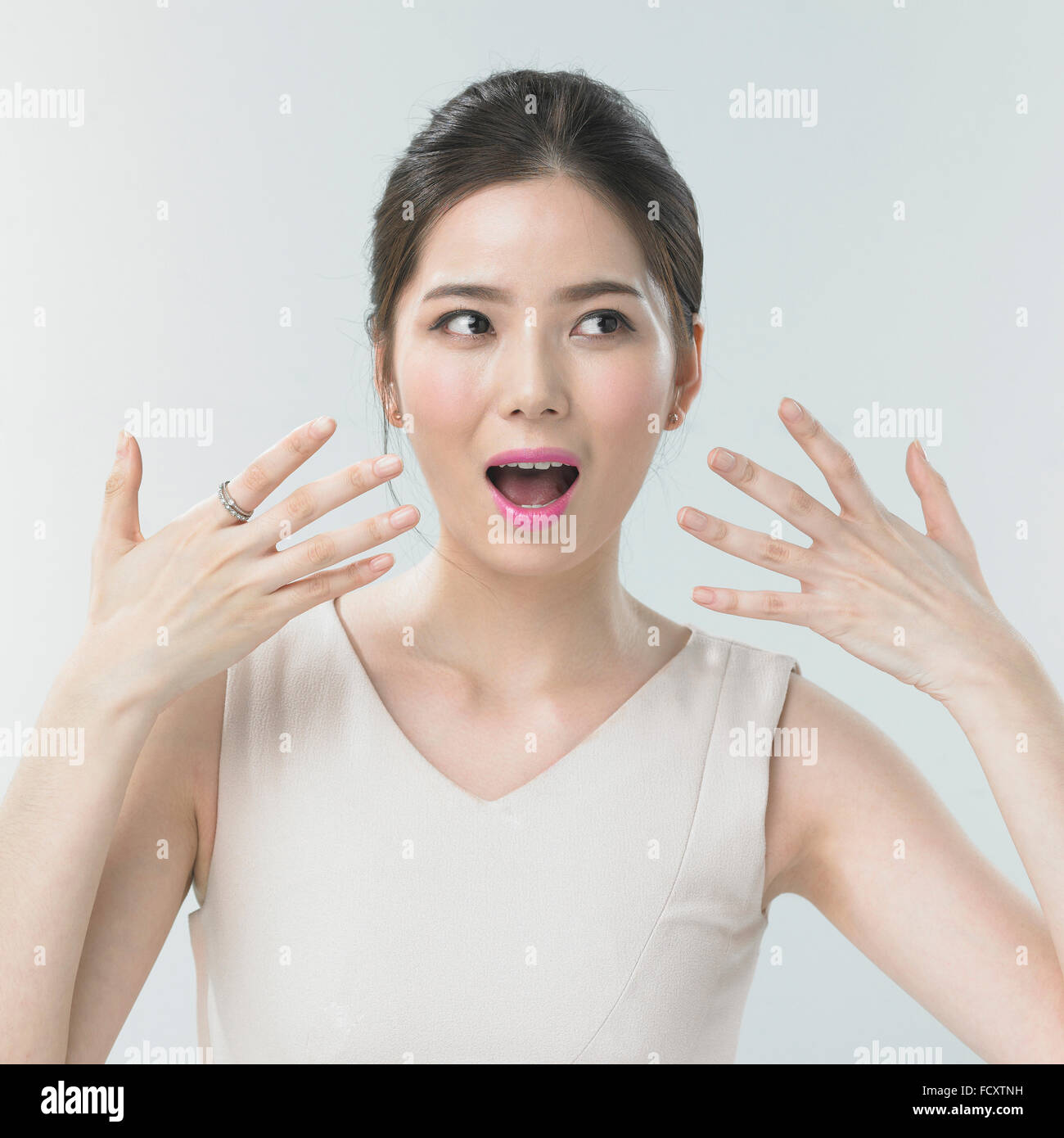 Portrait of young smiling woman with pink lips holding hands Stock ...