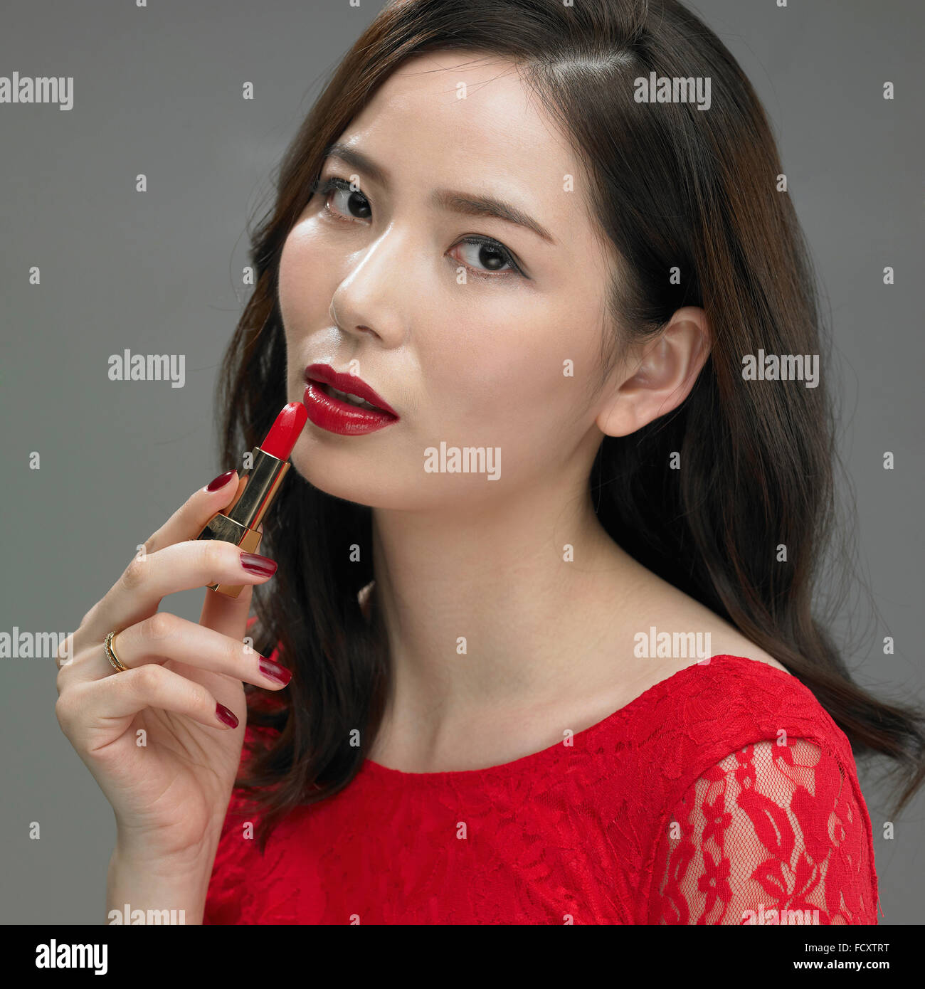 Asian young woman applying hi-res stock photography and images - Alamy