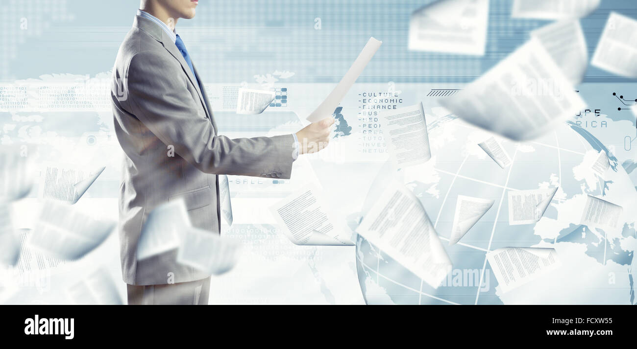 Back view of businessman reading documents in hand Stock Photo - Alamy