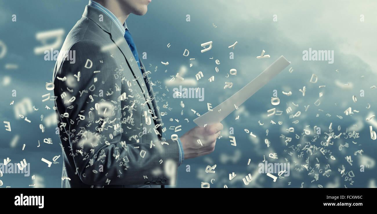 Back view of businessman reading documents in hand Stock Photo - Alamy
