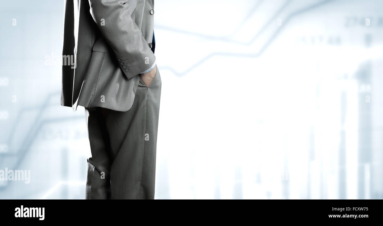 Bottom view of confident businessman against media background Stock ...