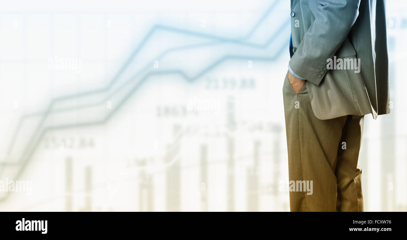 Bottom view of confident businessman against media background Stock ...