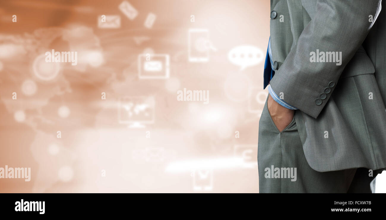 Bottom view of confident businessman against media background Stock ...