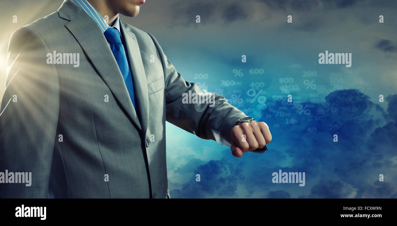 Close up of businessman looking at watch Stock Photo - Alamy