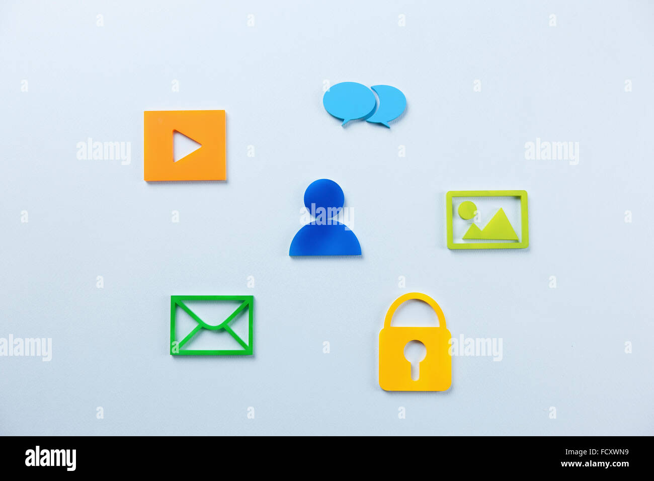 Human shape surrounded by mobile icons Stock Photo - Alamy