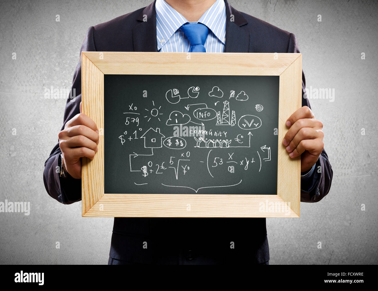 Close up of businessman holding frame with business sketch Stock Photo ...