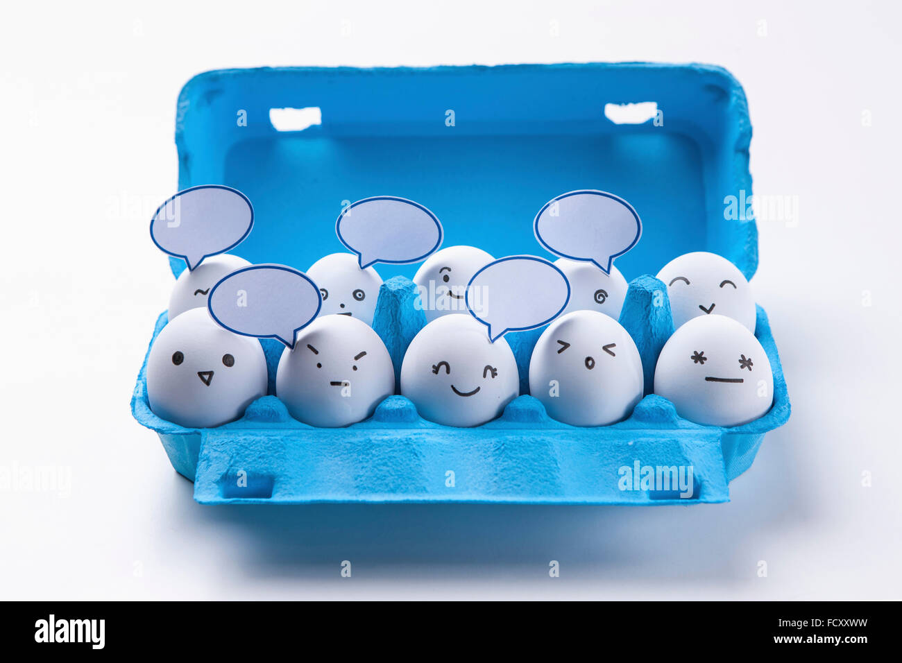 Eggs with various faces and speech balloons Stock Photo - Alamy